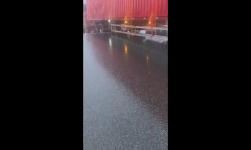 A lorry is left hanging over the edge after a major bridge collapse in ...